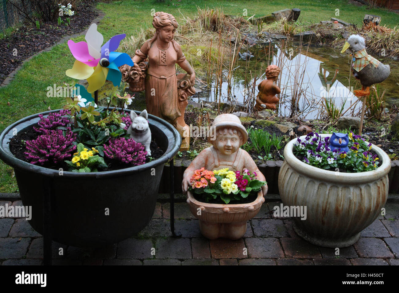 Garden, terrace, garden figures, flowers, pond, Germany, wind turbine ...