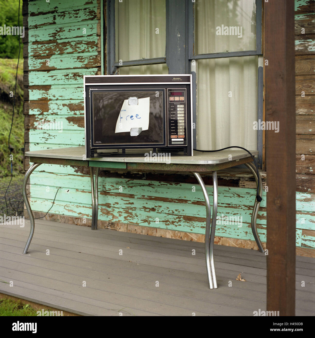 USA, Idaho, Harrison, house, old, veranda, table, microwave, note, for ...