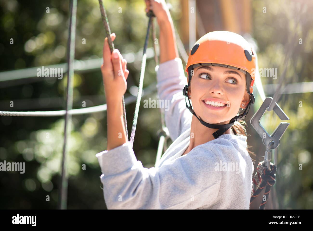 Happy cute woman looking to the left Stock Photo - Alamy