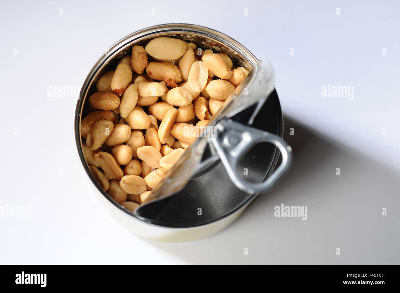 Tin peanuts, salted, openly Stock Photo - Alamy