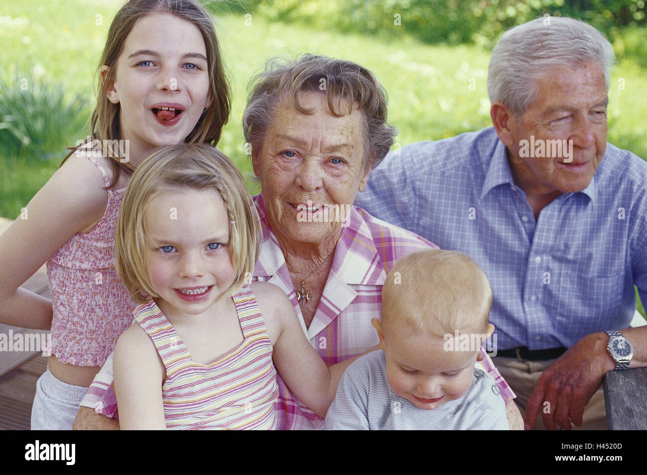 Senior couple, girl, baby, happy, portrait Stock Photo - Alamy