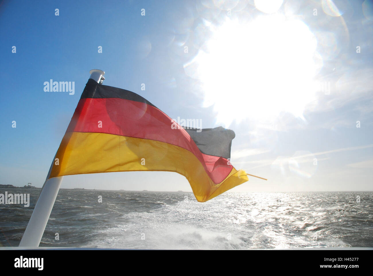 Sea, ship, rear, Germany flag, back light Stock Photo - Alamy