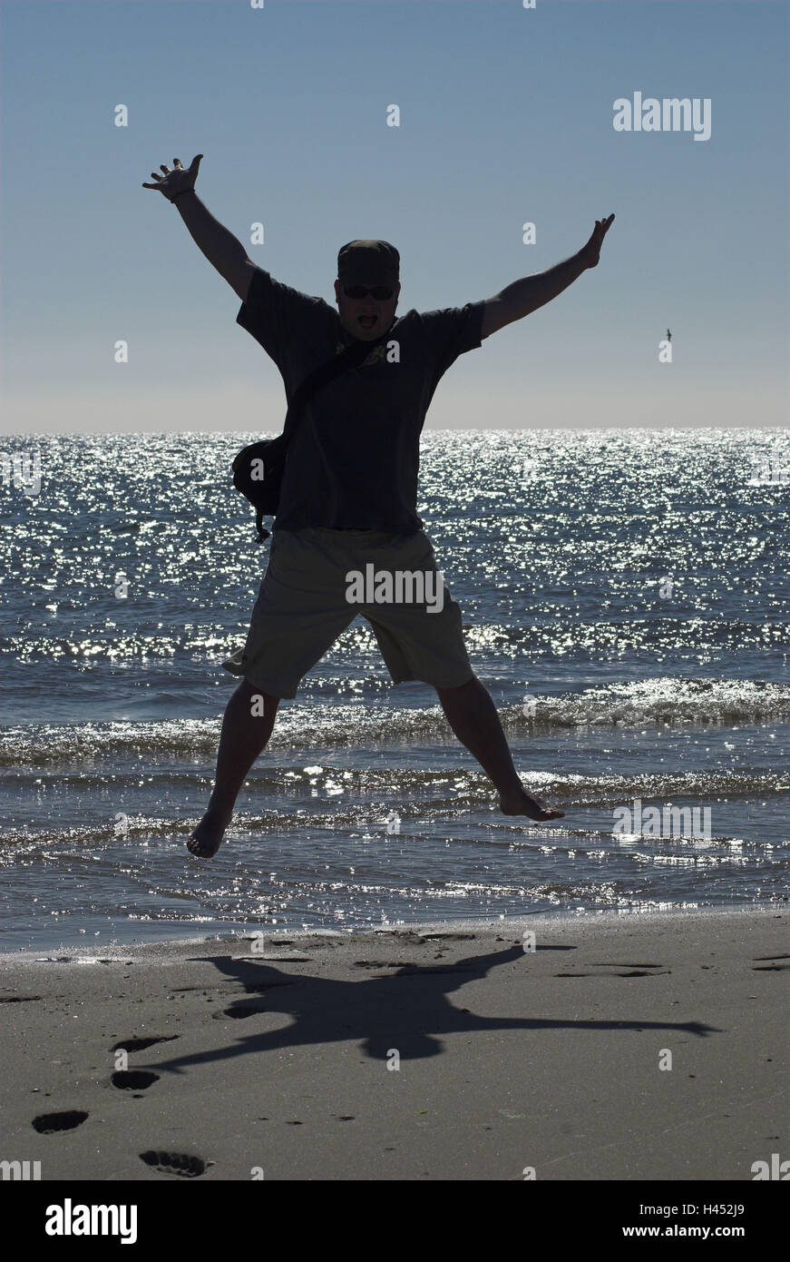 Sea, beach, man, crack, back light, model released Stock Photo - Alamy