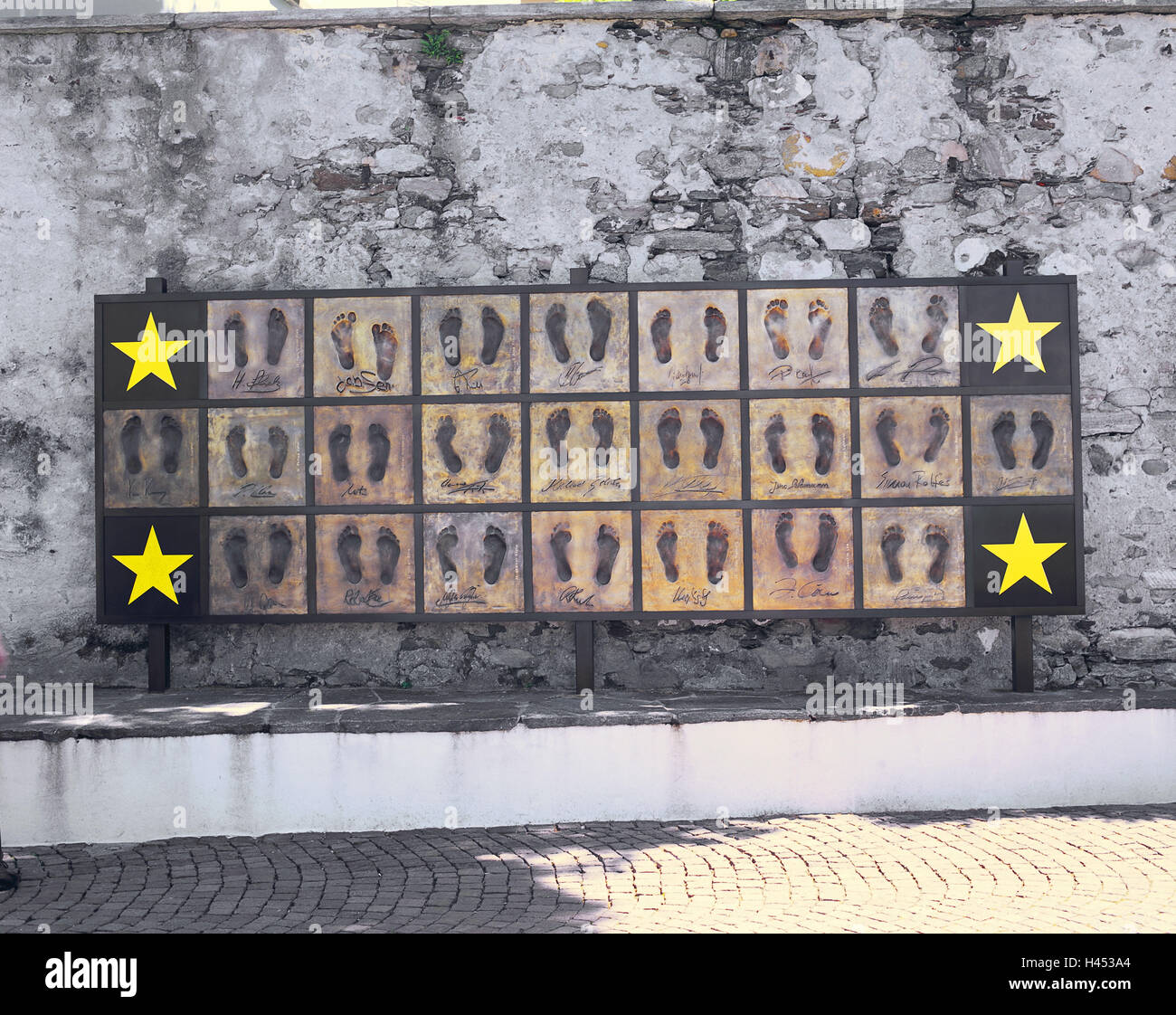 Switzerland, Ticino, Ascona, Piazza G Motta, bronze wall, footprints ...