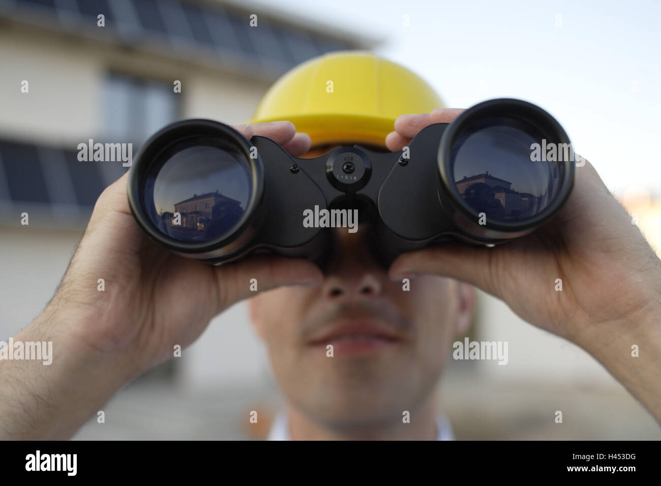 Man, young, construction helmet, binoculars, portrait, outside Stock ...