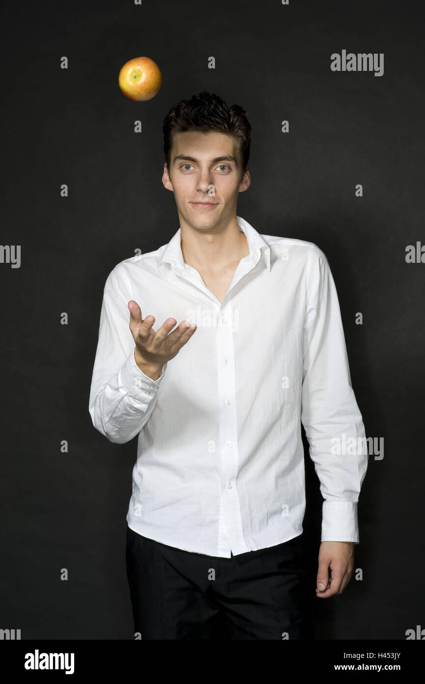 Man throwing apple hi-res stock photography and images - Alamy