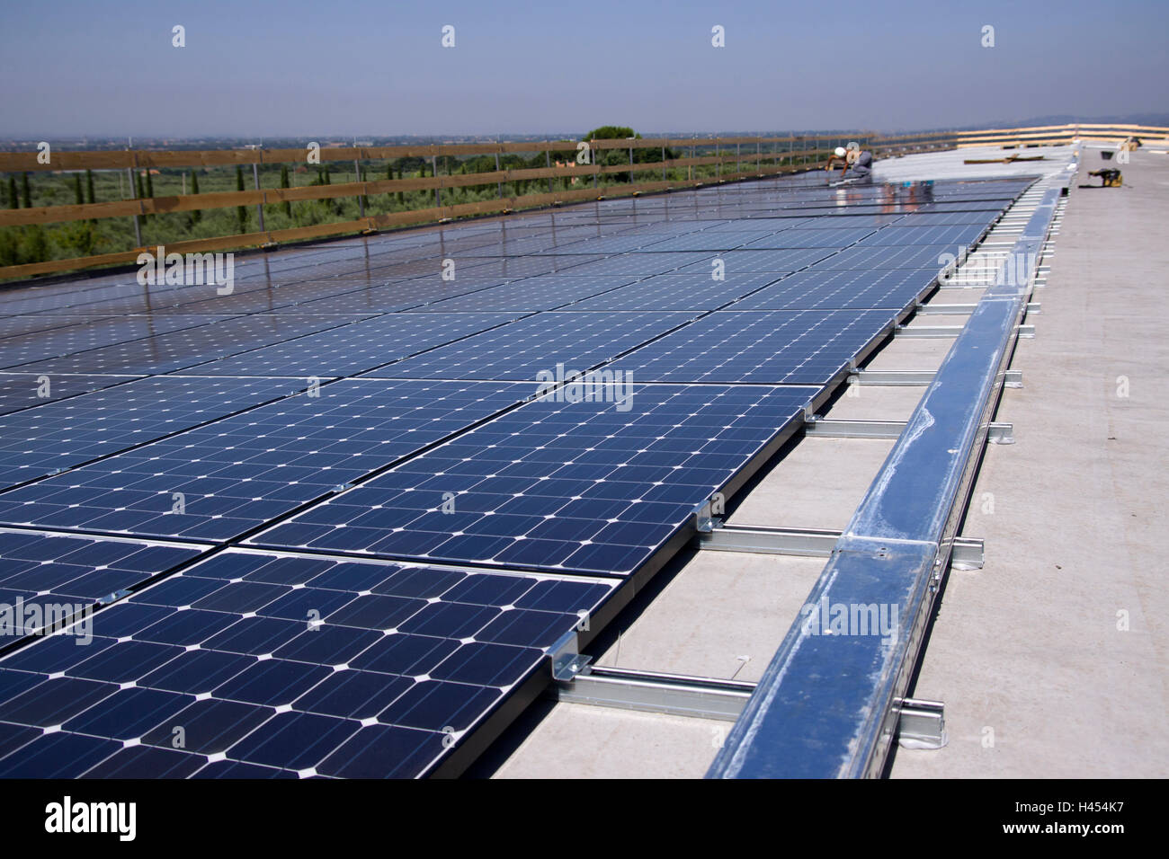 skilled worker fitting a photovoltaic plant on a roof Stock Photo - Alamy