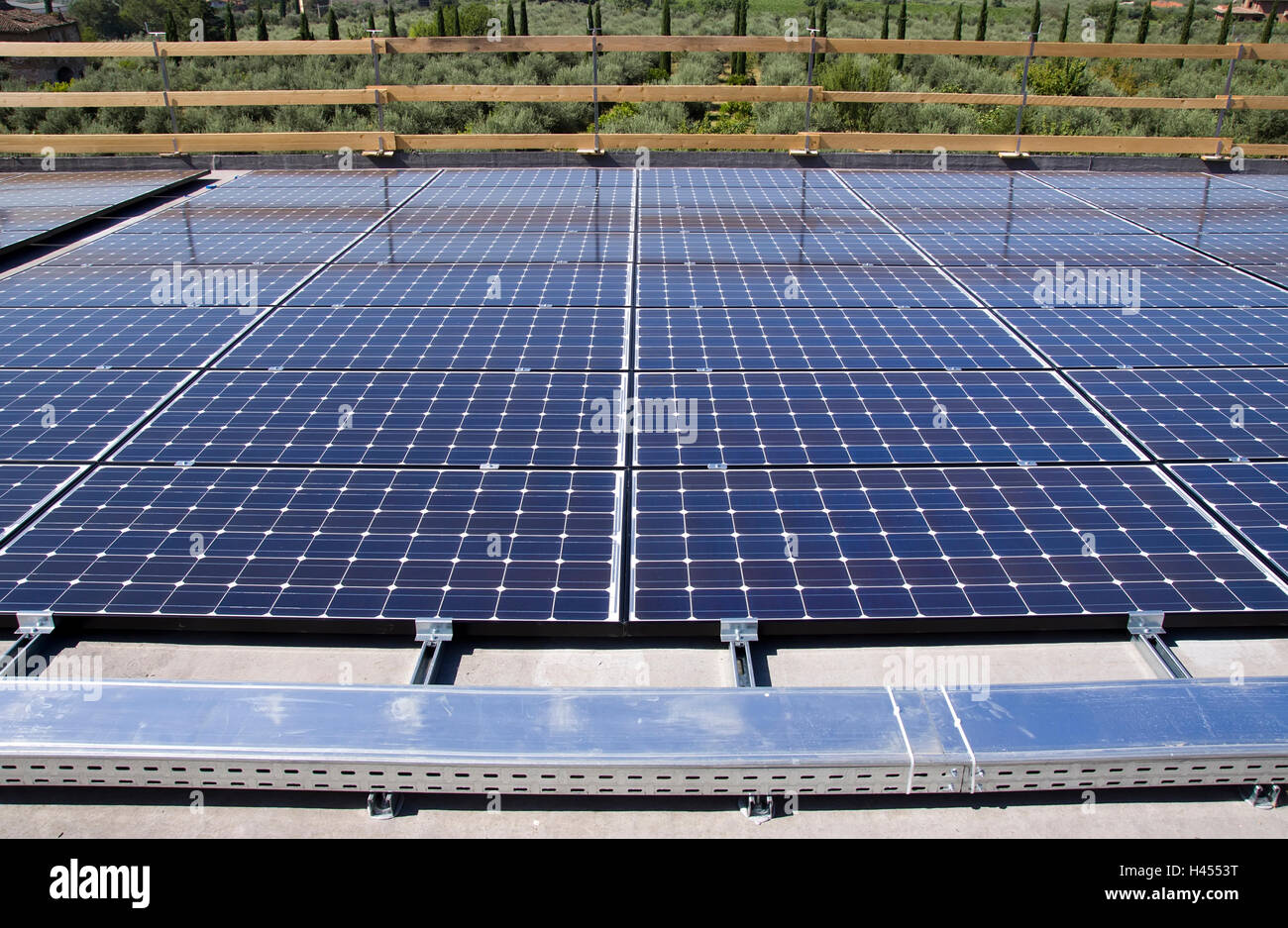 skilled worker fitting a photovoltaic plant on a roof Stock Photo - Alamy