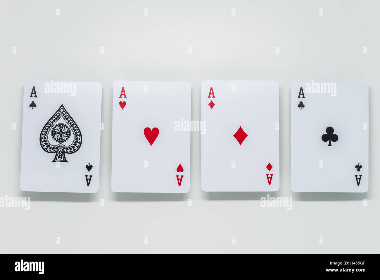 Four Ace cards lay on white background and selective focus Stock Photo ...