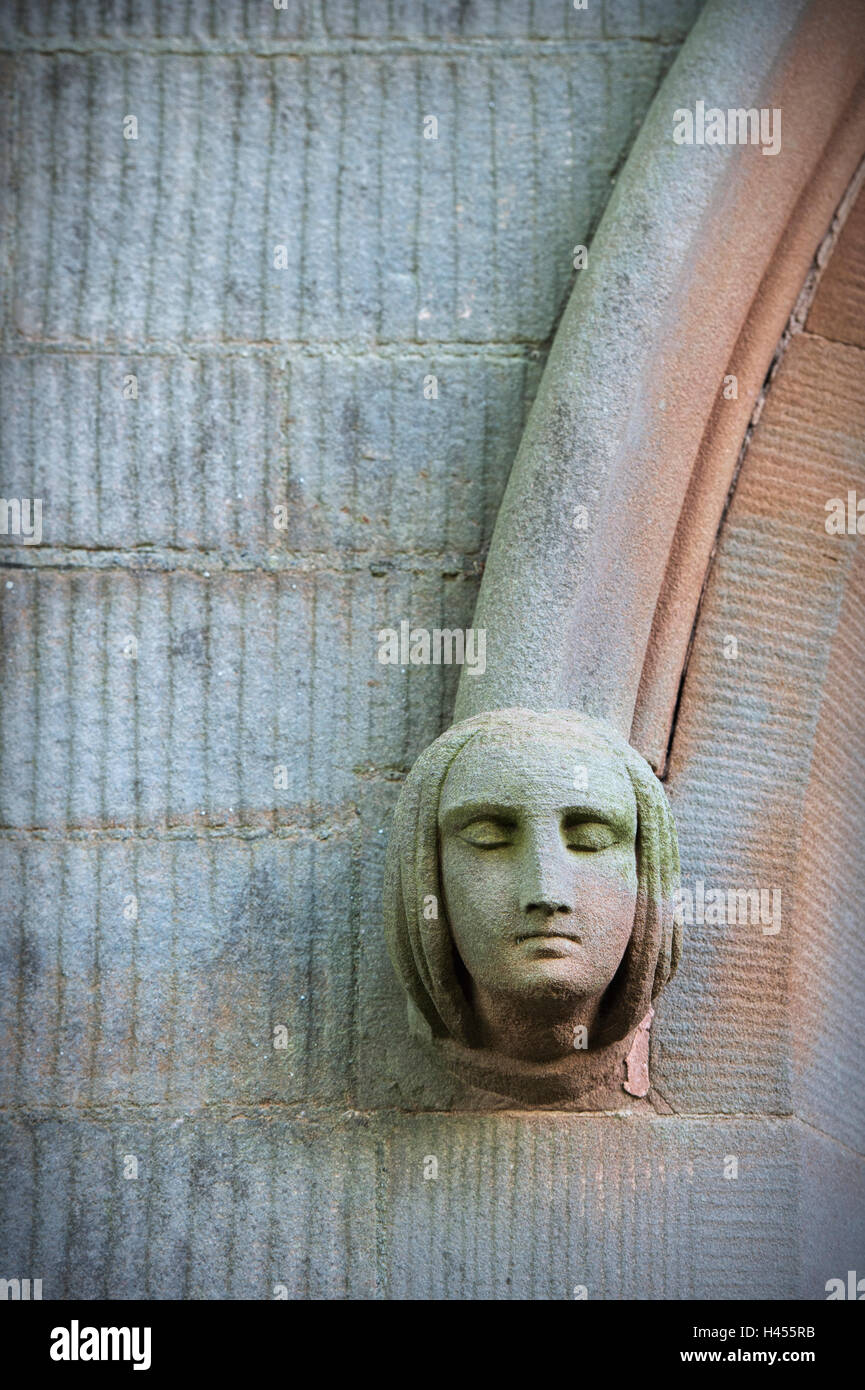 Stone face on a church window surround with closed eyes. Wasperton ...