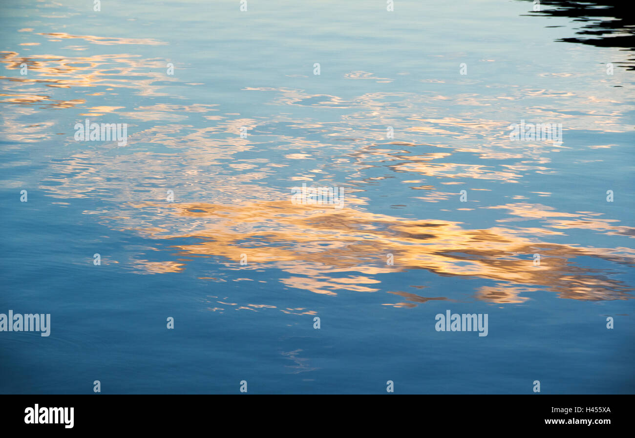 Water ripples and cloud reflections at sunrise in Scotland Stock Photo ...