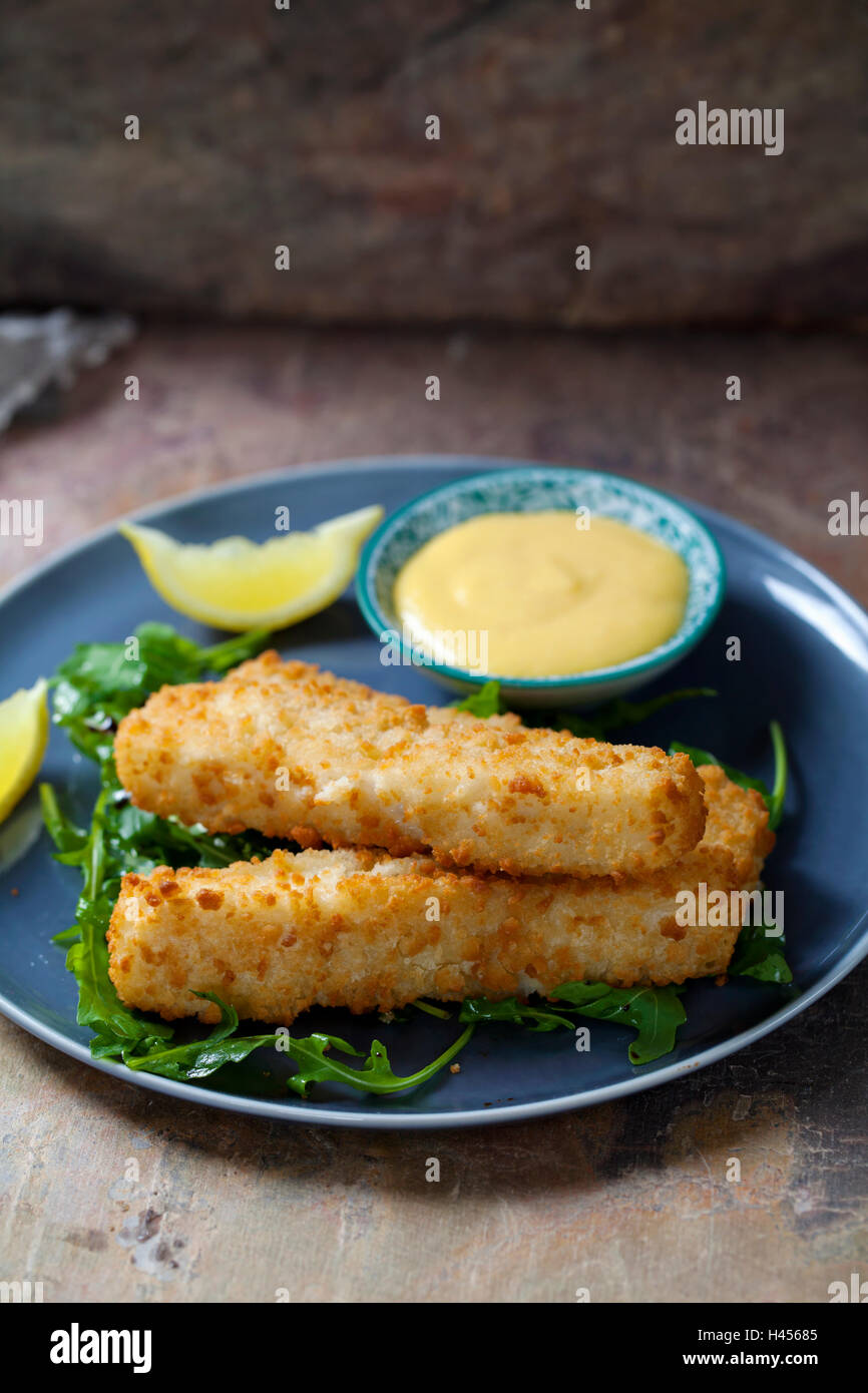 Fish fingers with homemade aioli and rocket salad Stock Photo - Alamy