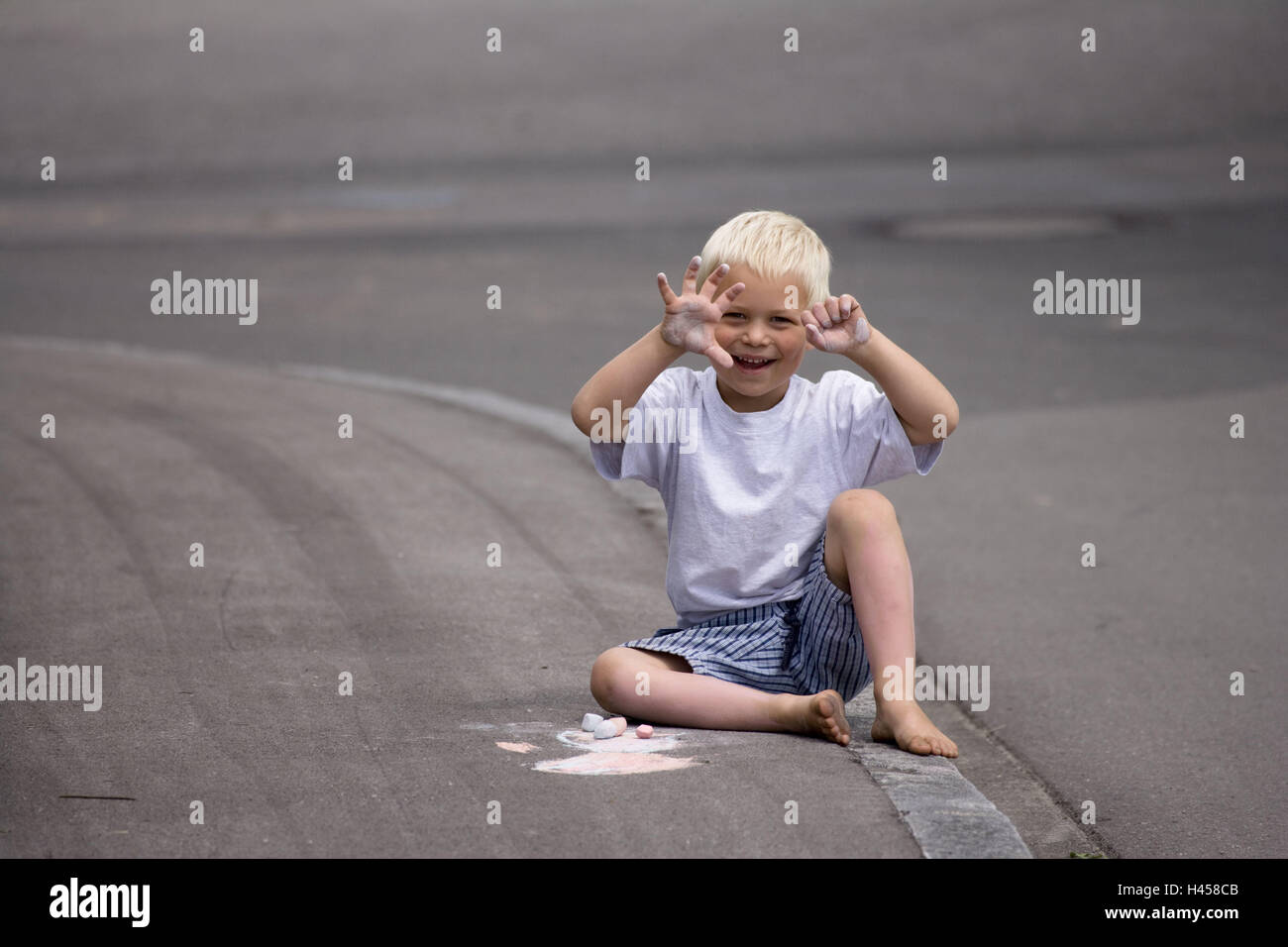 Boy, happy, hands point, painting chalk, street, sit, people, child ...