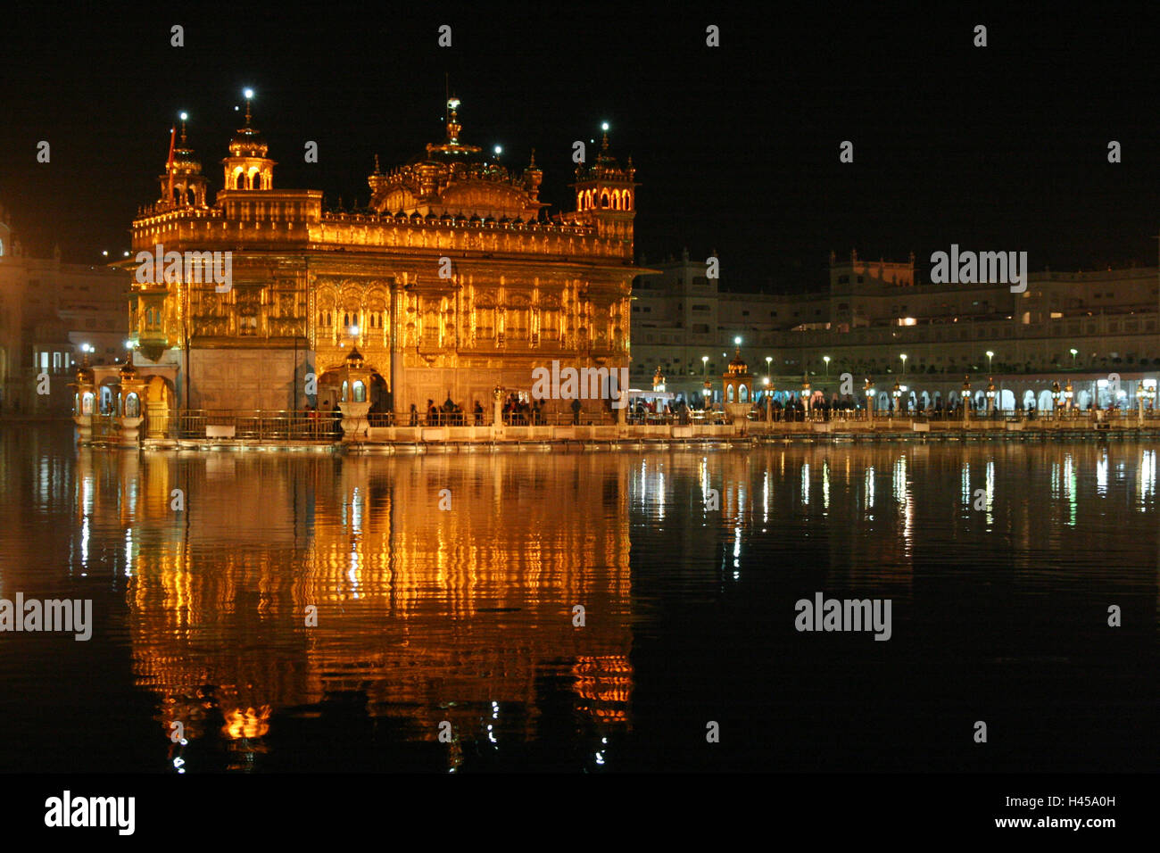 Water reflection of the Golden Temple at night, Amritsar, India Stock ...