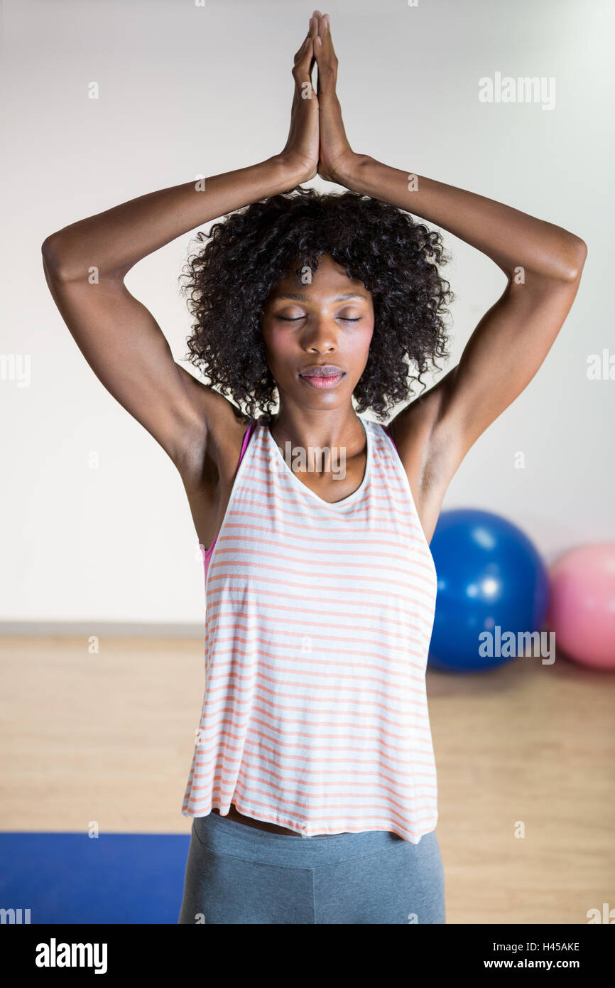 Woman performing yoga Stock Photo - Alamy