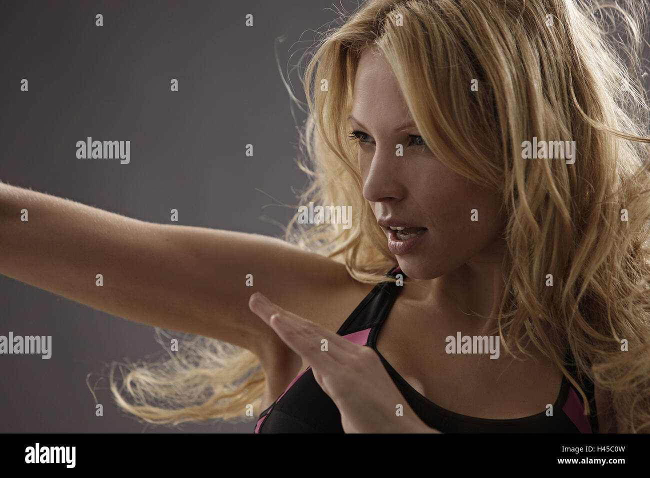 Woman, fitness, Bodycombat, gesture, portrait, curled Stock Photo - Alamy