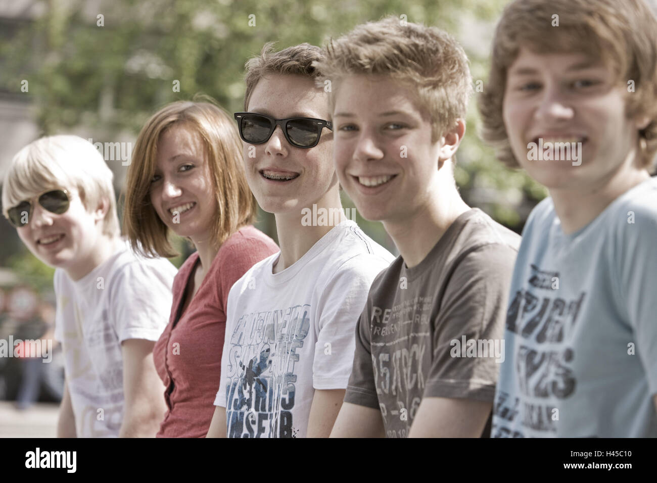 Town, teenager, sit, group picture Stock Photo - Alamy