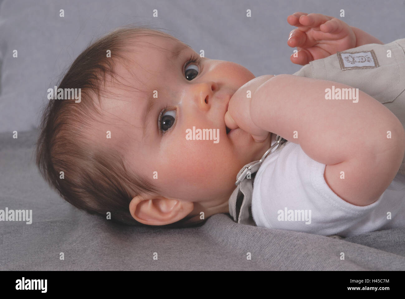 Baby, girl, back, lie, observe finger, mouth, portrait, curled, infant ...