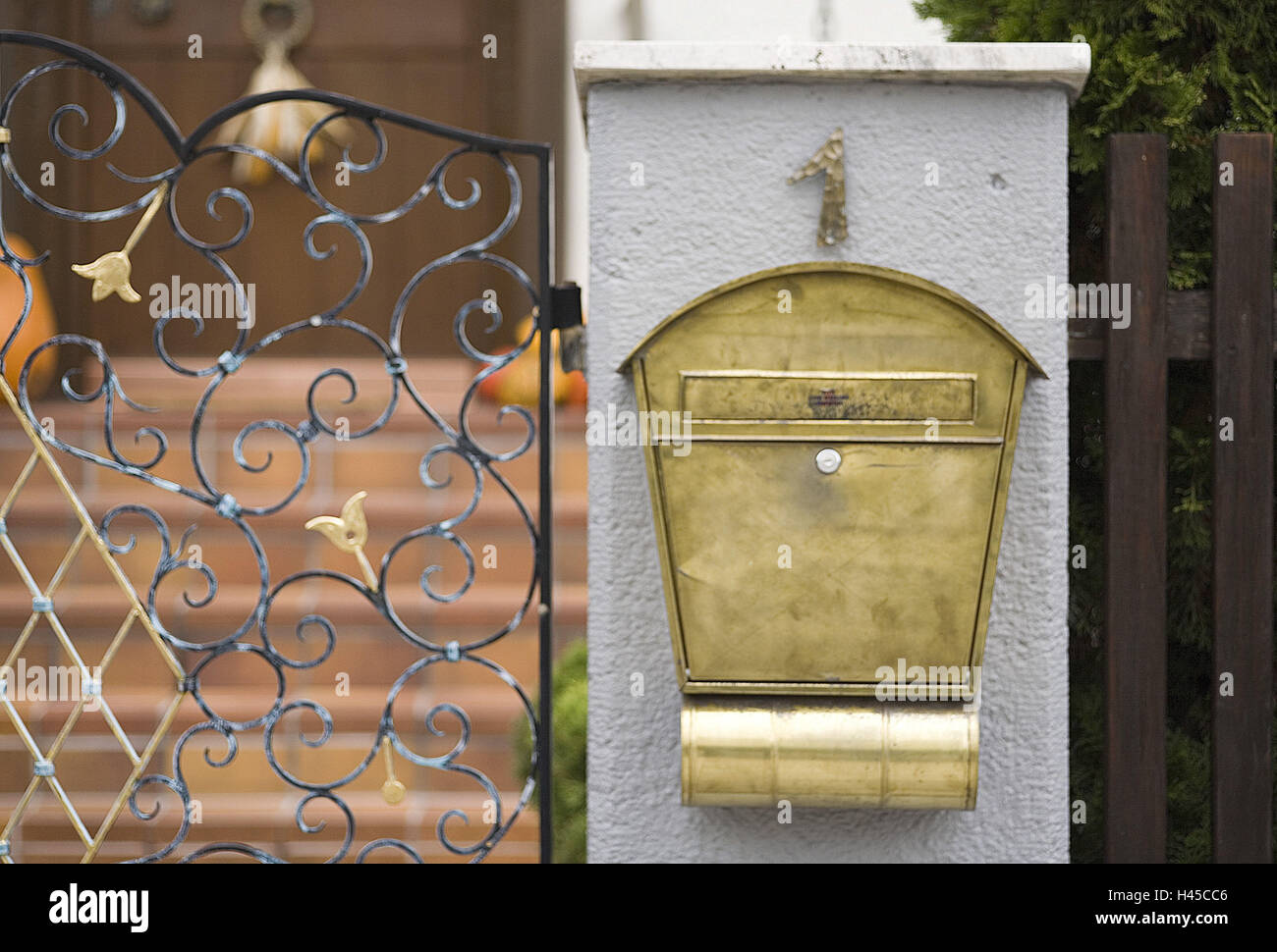 Brass mailbox, newspaper role Stock Photo - Alamy