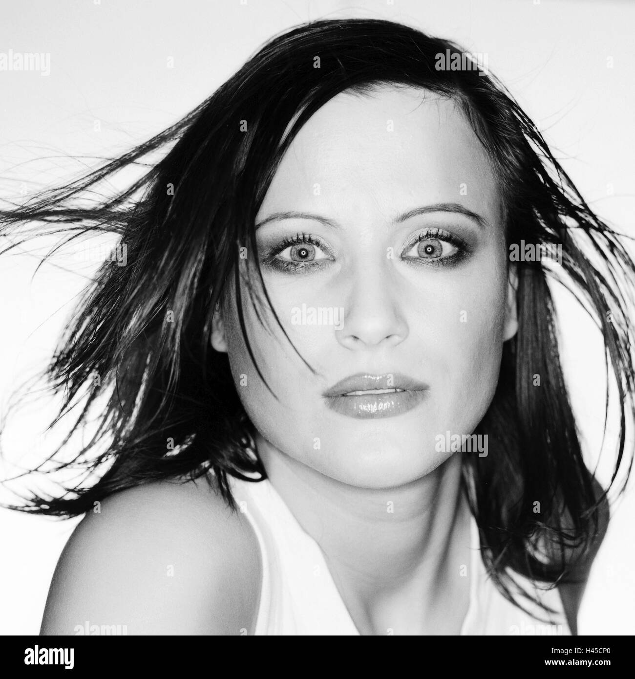 Young woman with blowing hair in the portrait, b/w, model released ...