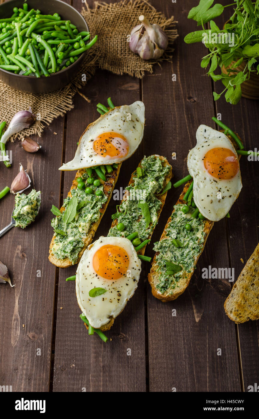 Healthy rustic baguette with herb butter and vegetables Stock Photo - Alamy