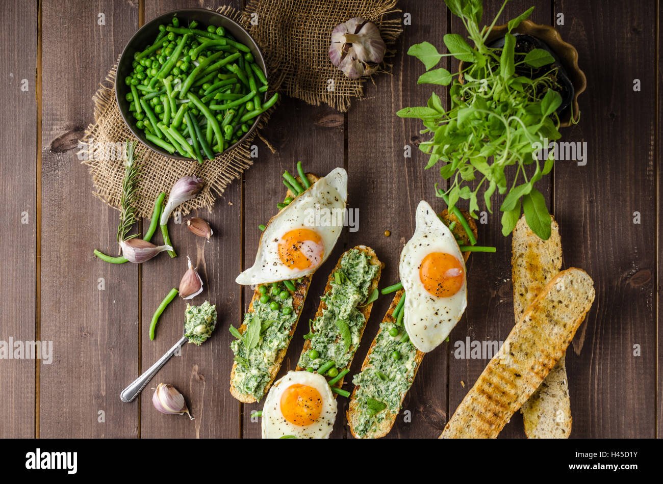 Healthy rustic baguette with herb butter and vegetables Stock Photo - Alamy