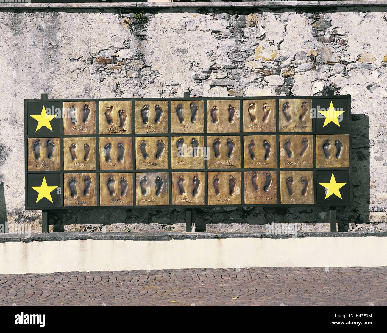 Switzerland, Ticino, Ascona, Piazza G Motta, bronze wall, footprints ...