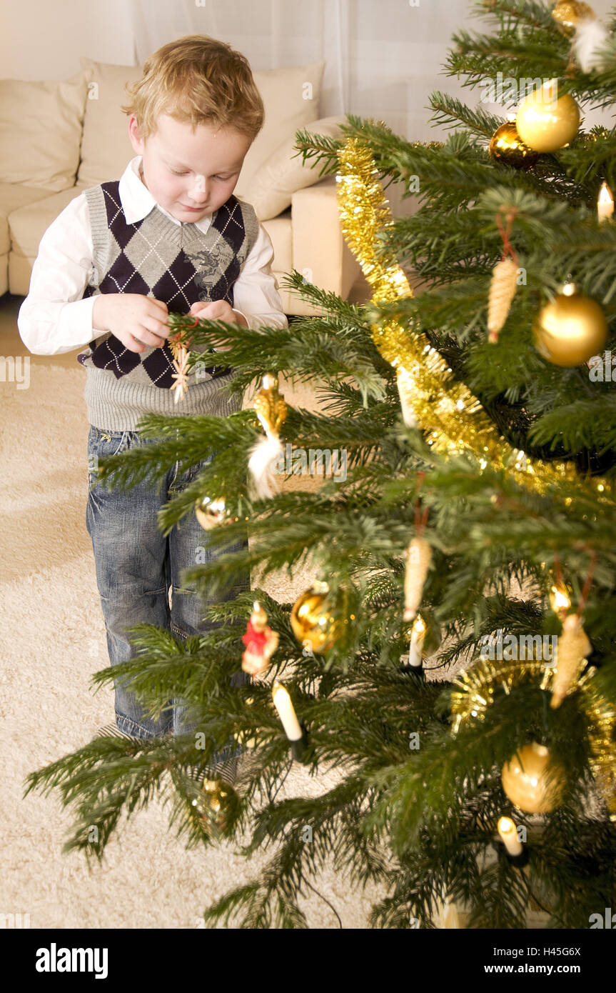 Boy, Christmas tree, decorate Stock Photo - Alamy