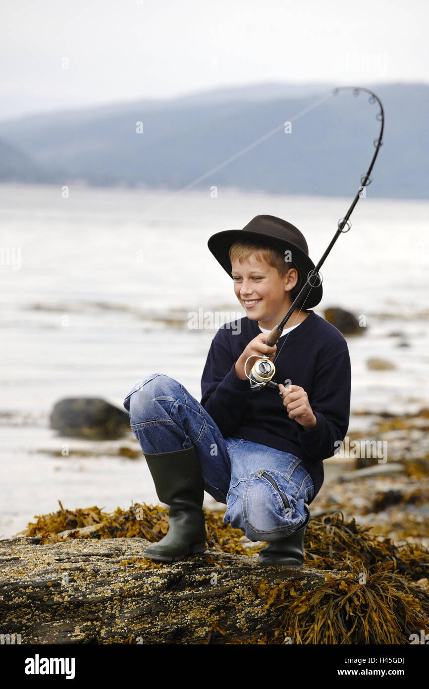 Boy, fishing rod, shores Stock Photo - Alamy