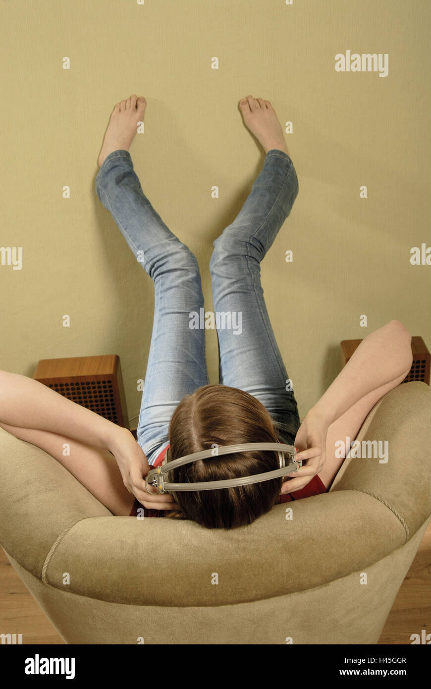 Woman, young, earphones, music hearing, armchair, sit, support barefoot ...