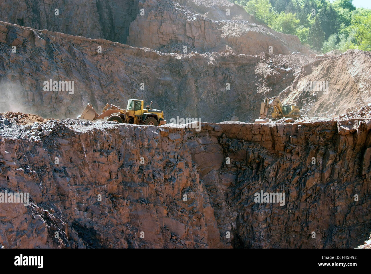 Quarry, crawler tractor, excavator Stock Photo - Alamy