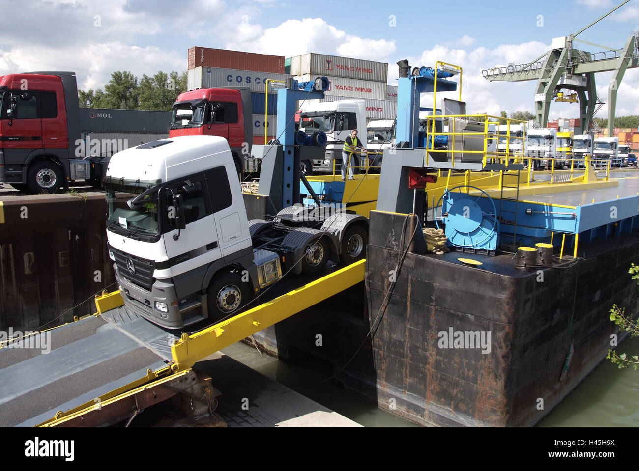 Inland harbour, shipping, truck loading Stock Photo - Alamy