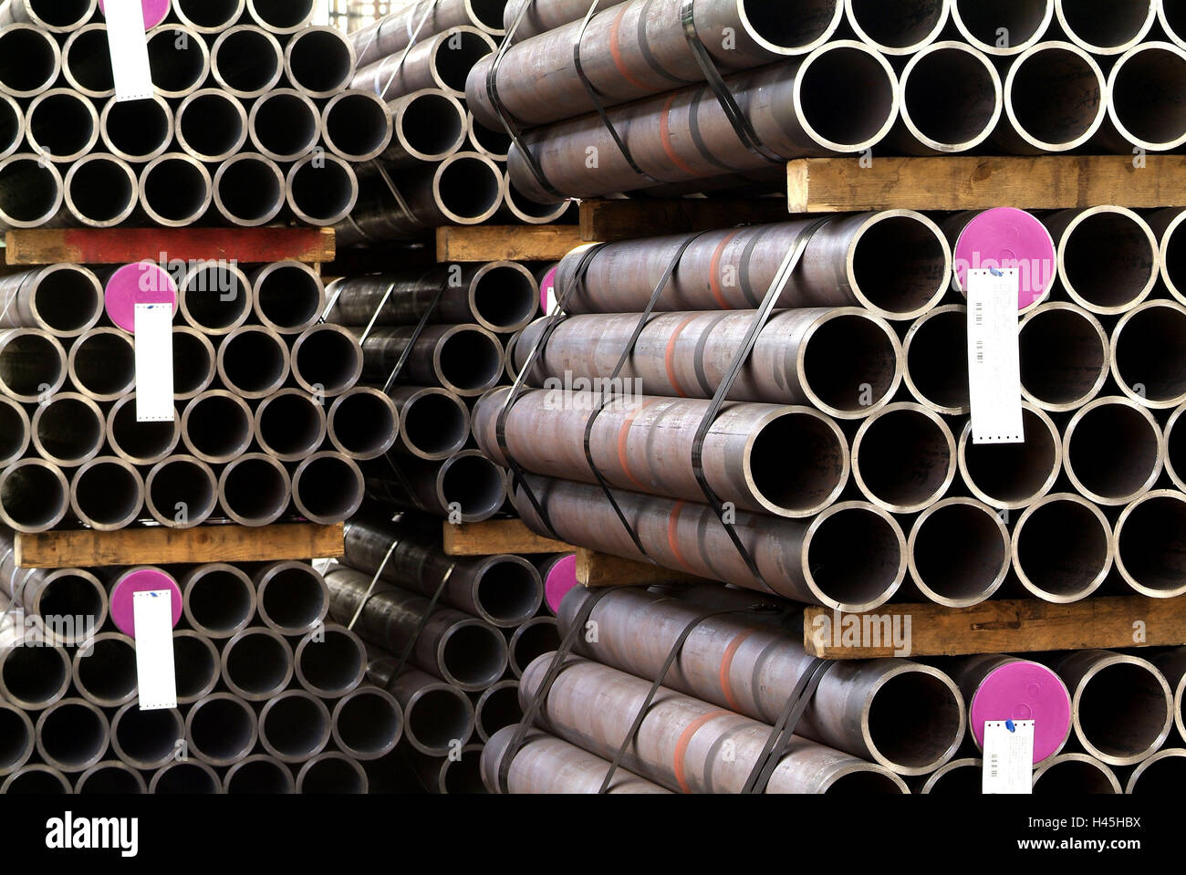 Pipe factory, store, pipes, stacked Stock Photo - Alamy