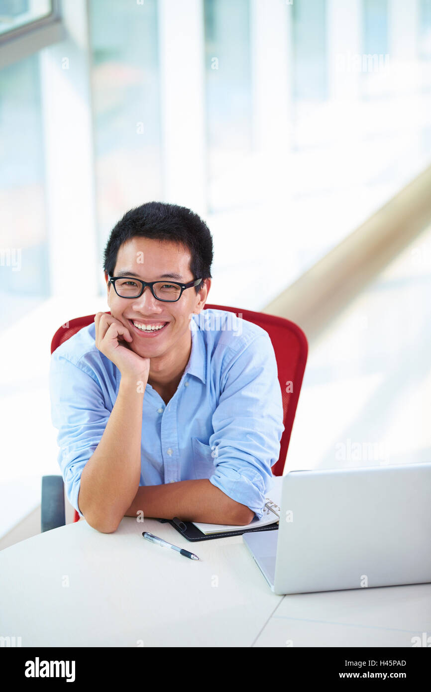 Young asian businessman working in the office Stock Photo - Alamy