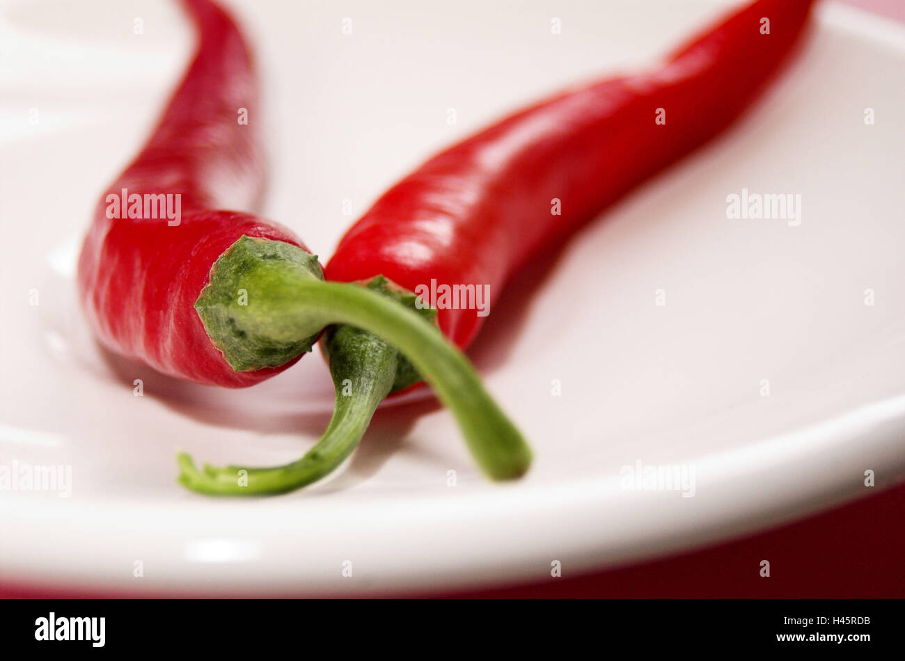 Plate, chilli pods, detail, blur Stock Photo - Alamy