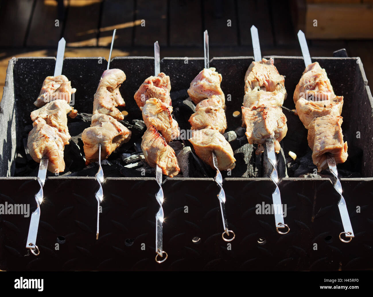 Grilled meat on terrace outdoors Stock Photo - Alamy