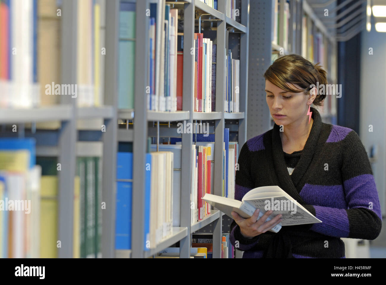 Woman, young, book, library Stock Photo - Alamy