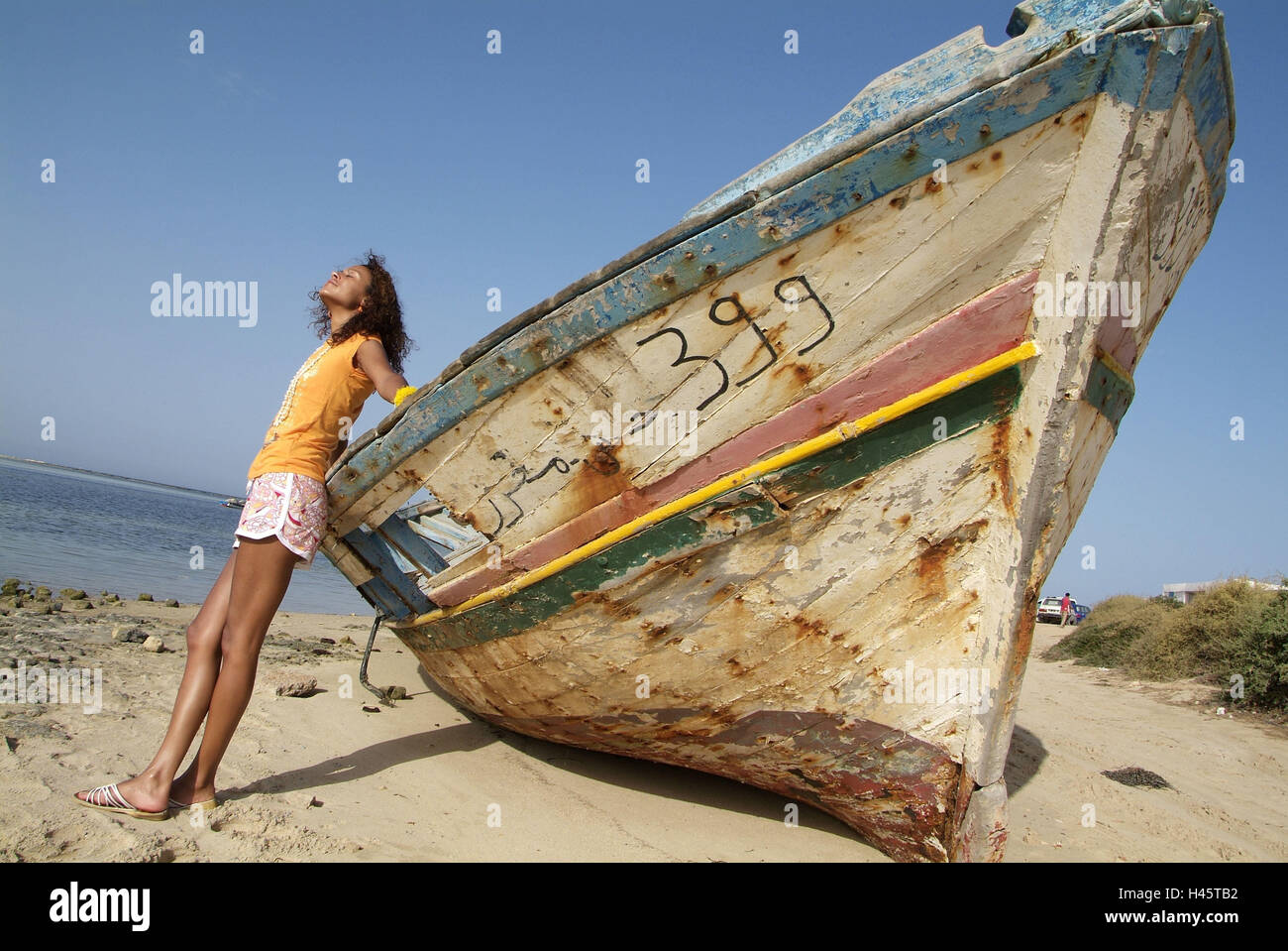 Tunisia, Djerba, woman, young, beach, fishing boat, sea Stock Photo - Alamy