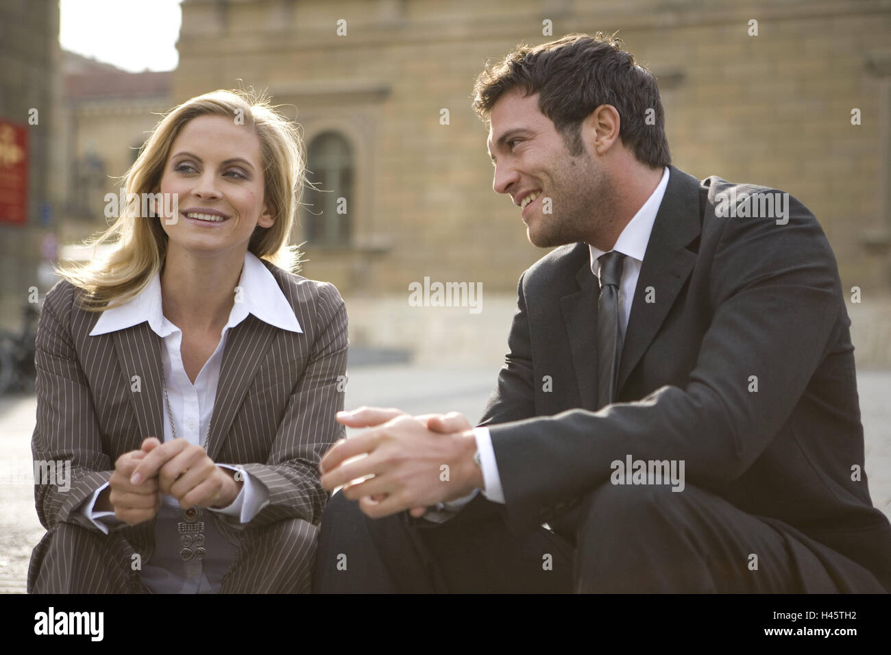 City, business people, stairway, sit, conversation, eye contact ...