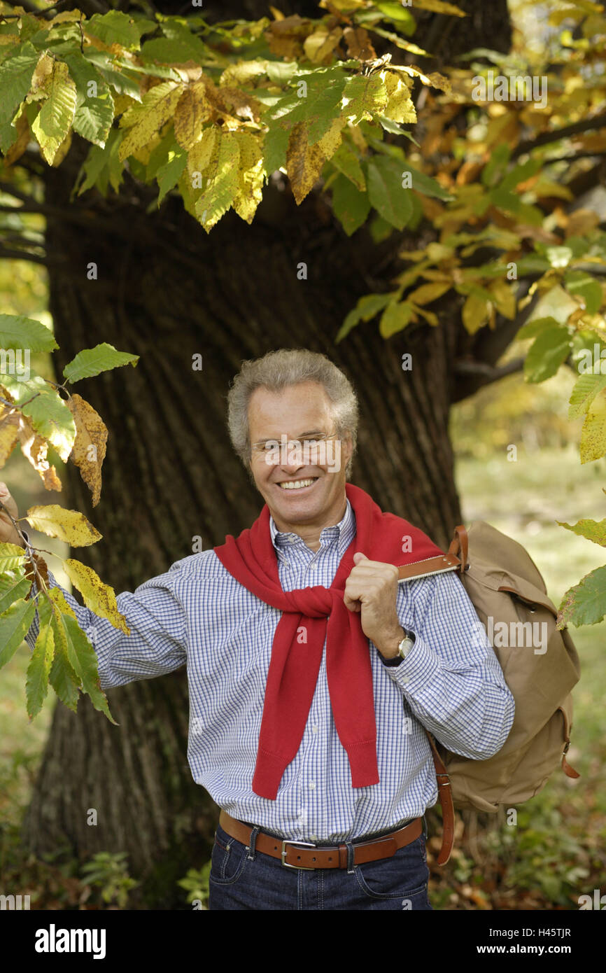 Man, senior, tree, autumn, content Stock Photo - Alamy