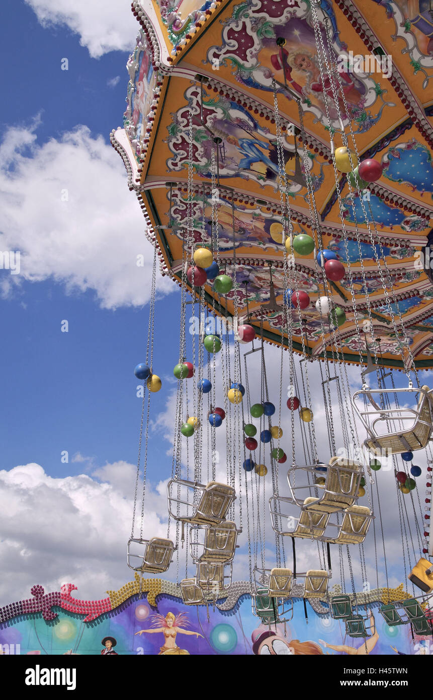 Spring feast, catena carousel, cloudy sky, detail, public festival ...
