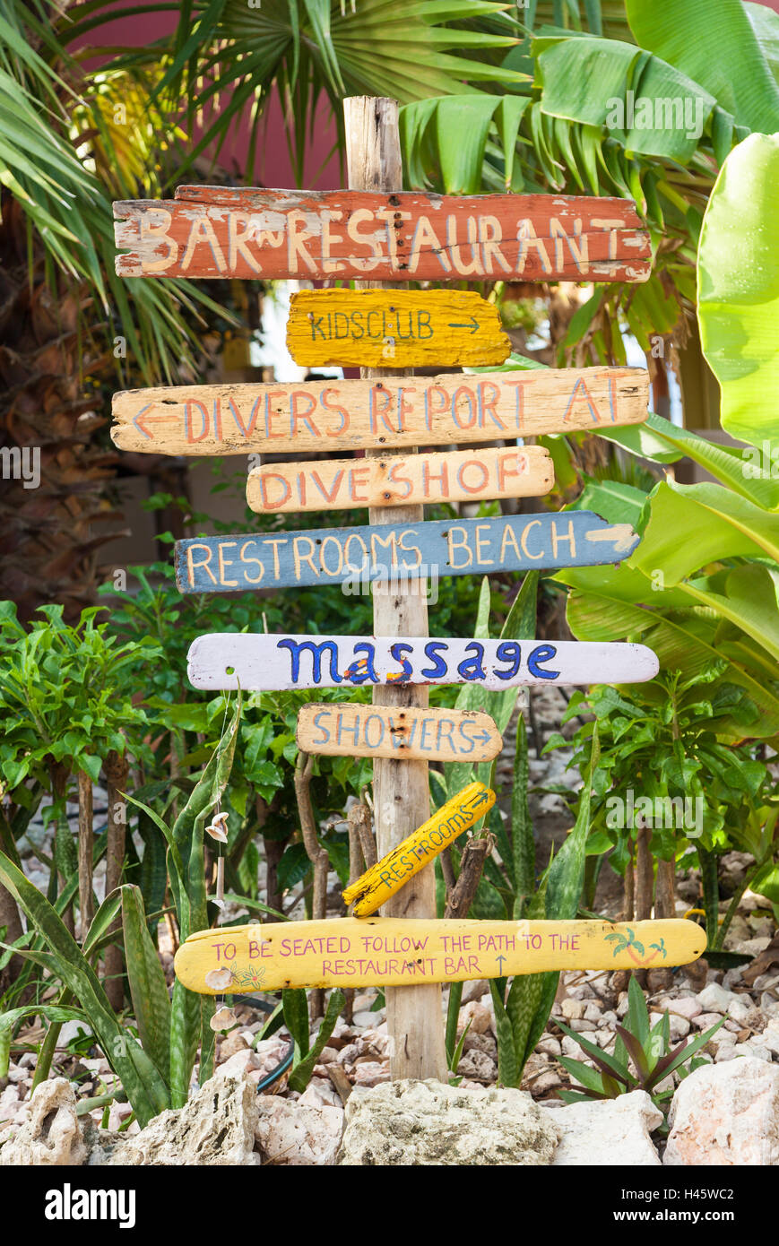 Signpost at tropical resort Stock Photo - Alamy