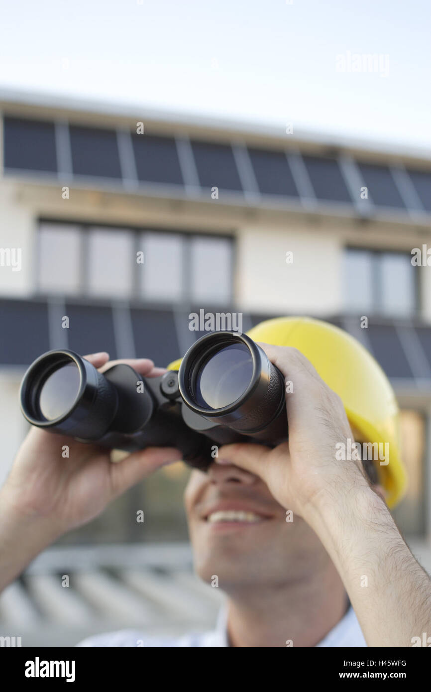 Man, young, construction helmet, binoculars, portrait, outside Stock ...