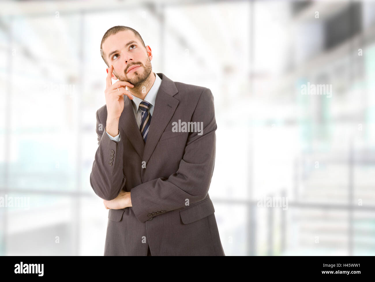 young business man thinking at the office Stock Photo - Alamy