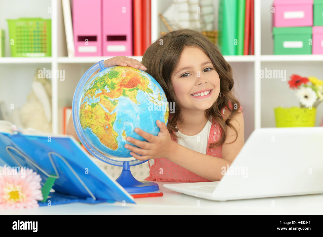 student girl with book and laptop Stock Photo - Alamy