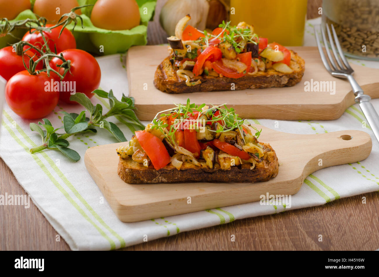 Healthy dinner - a panini toast with Mediterranean vegetables and herbs ...