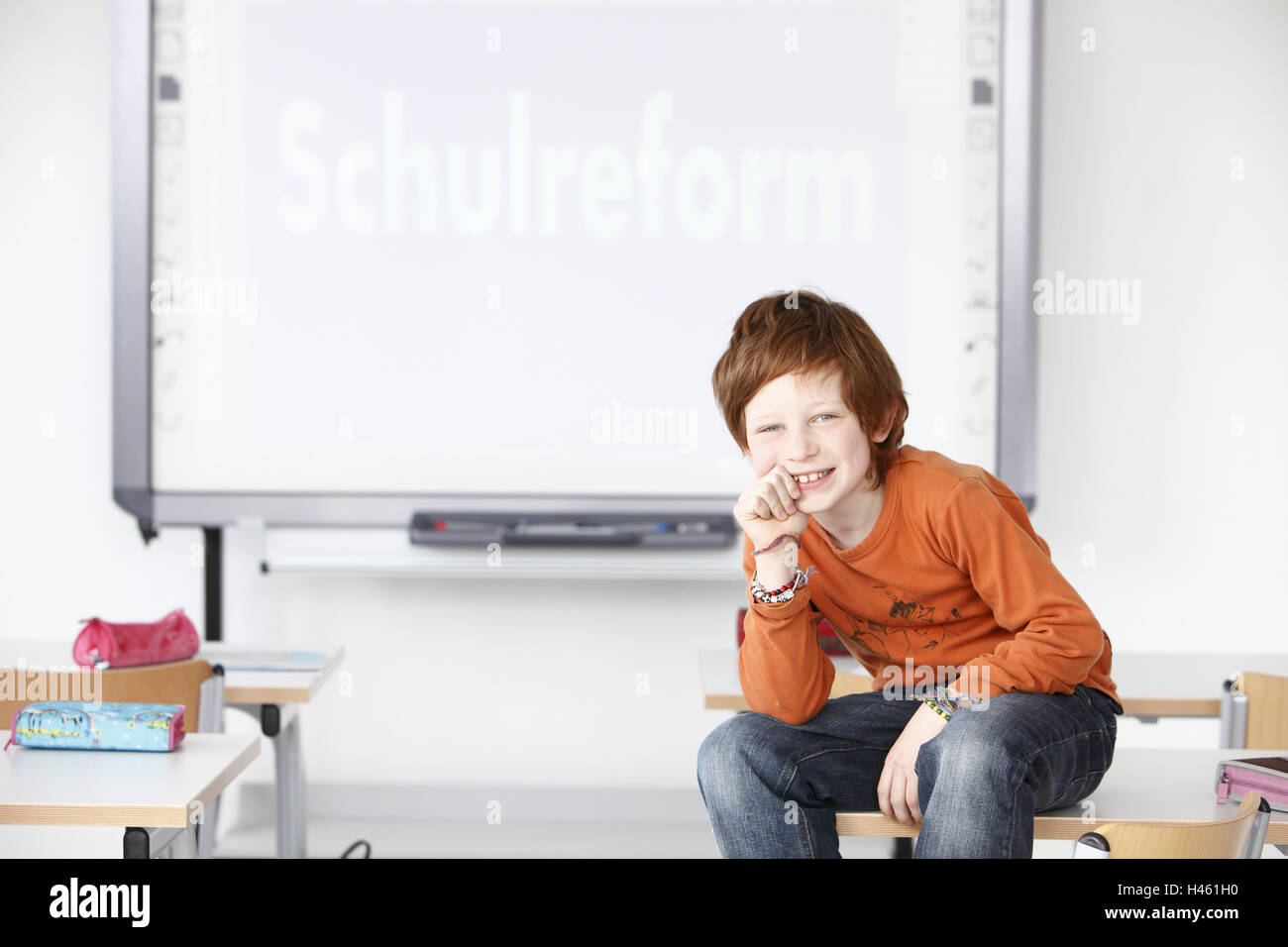 Boy, classrooms, table, sit, smile Stock Photo - Alamy