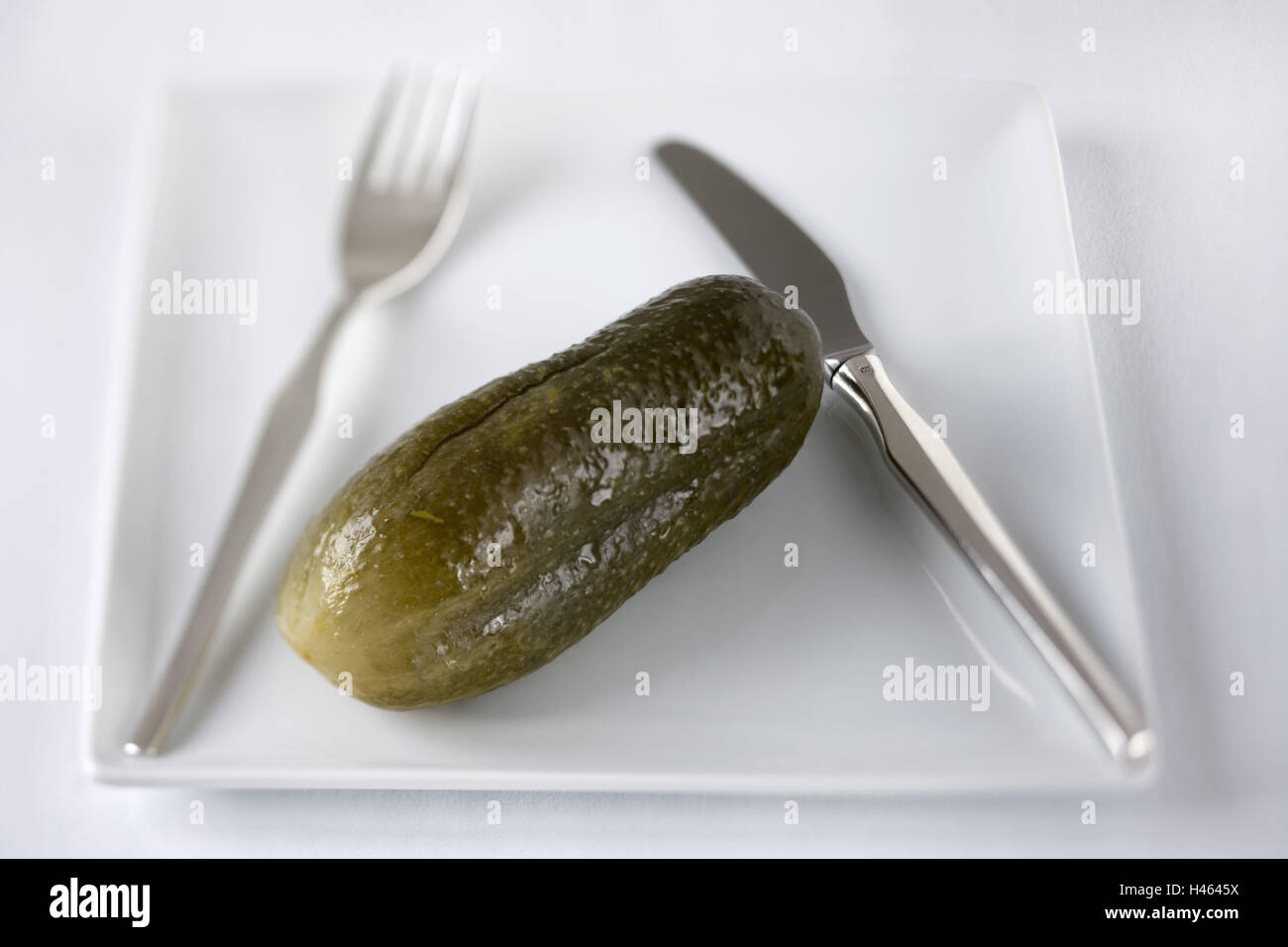 Gherkin, cutlery, plate Stock Photo - Alamy