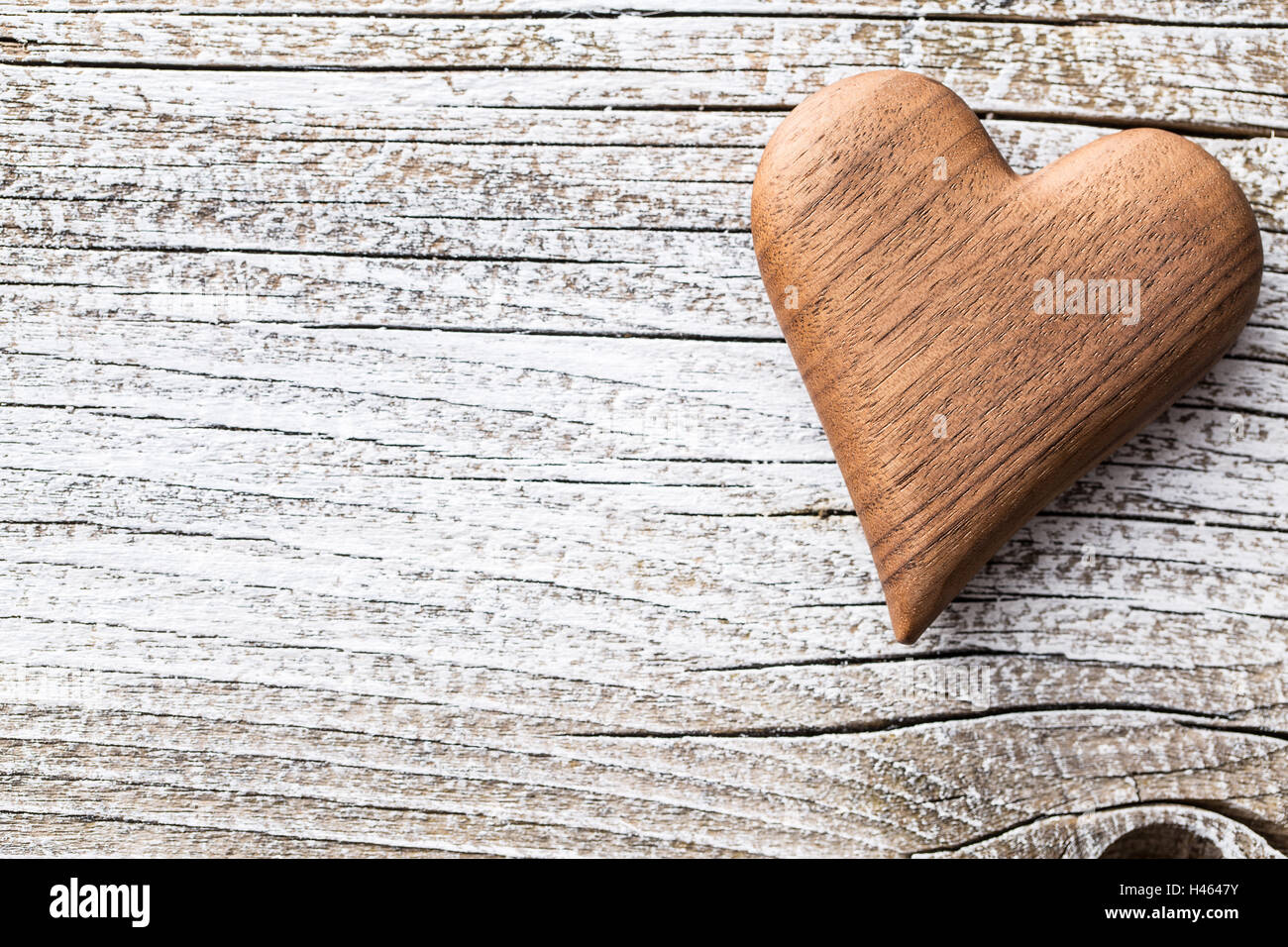 Handmade wooden heart on wooden table. Top view Stock Photo - Alamy