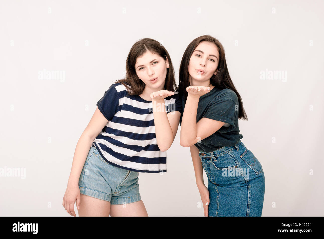 Positive friends portrait of two girls, funny faces, grimaces Stock ...